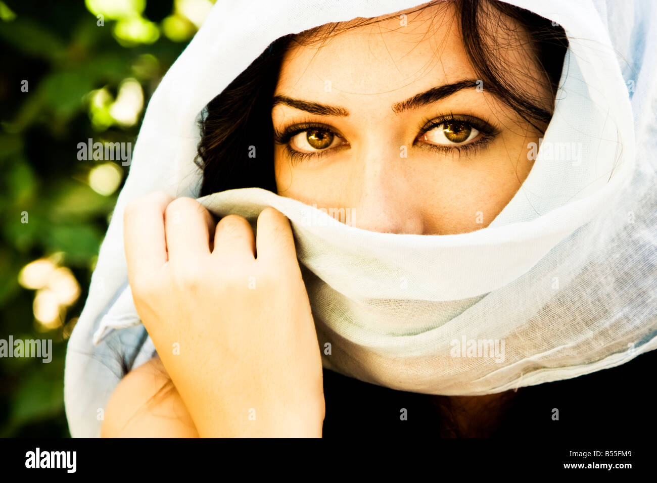 Young green eyed woman behind veil Stock Photo - Alamy