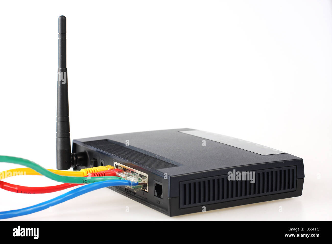 small network router with colored network cables connected Stock Photo ...