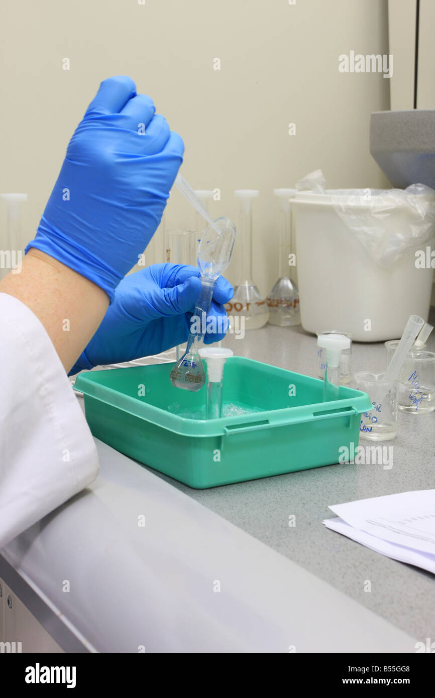 scientist working with test tubes and substances in a real laboratory ...