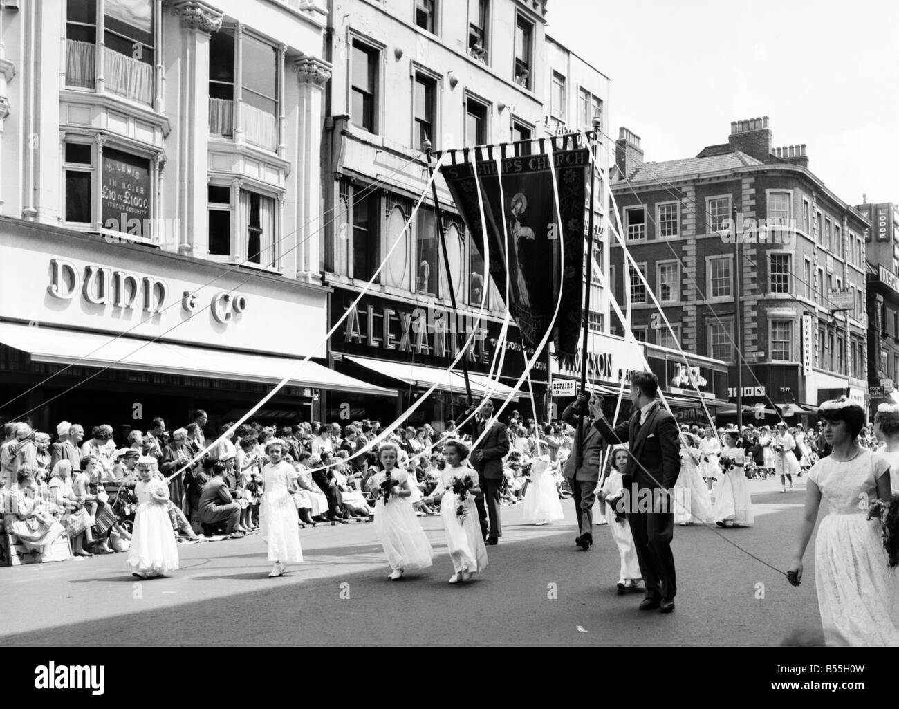 Children carrying a banner in the Whit Walk at Manchester. June 1960 ...