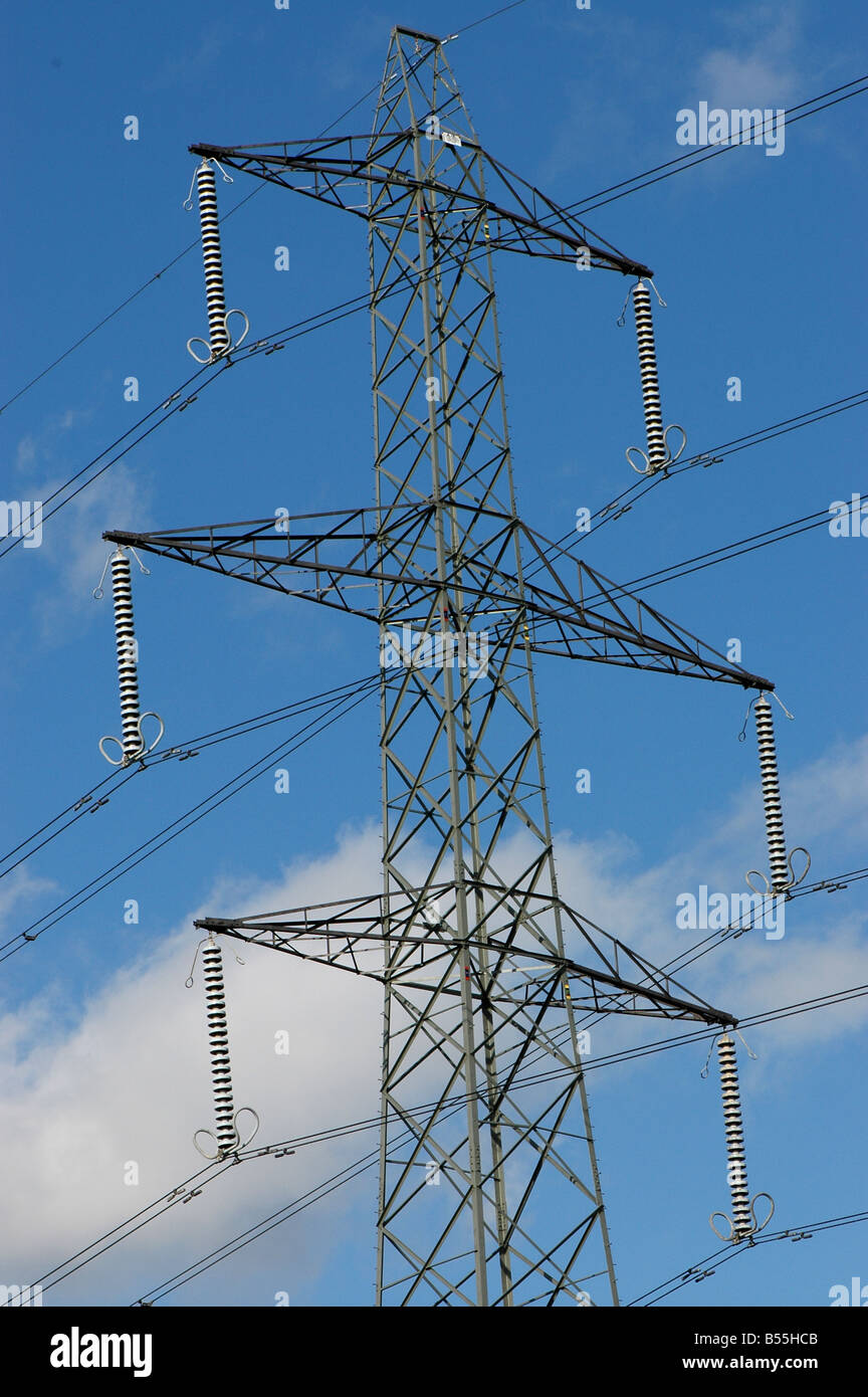 An electricity pylon with blue sky above Stock Photo - Alamy