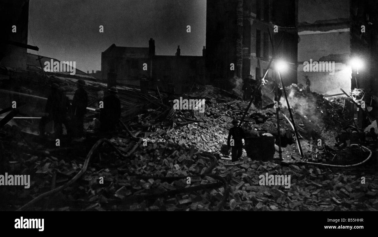 Firemen were still playing their hose on to the smouldering ruins of a ...