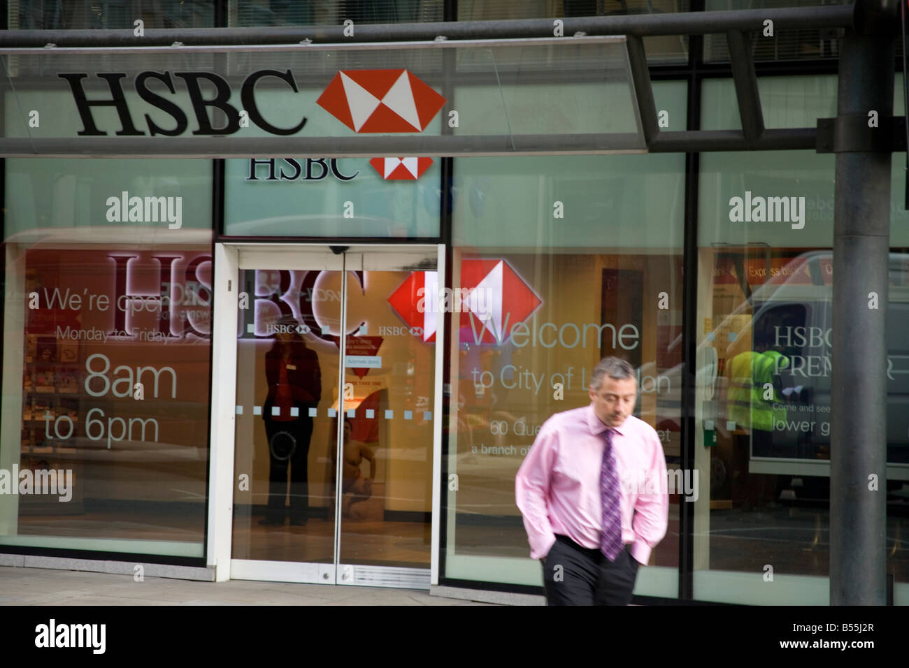 Man walking in front of HSBC Bank shopfront Stock Photo - Alamy