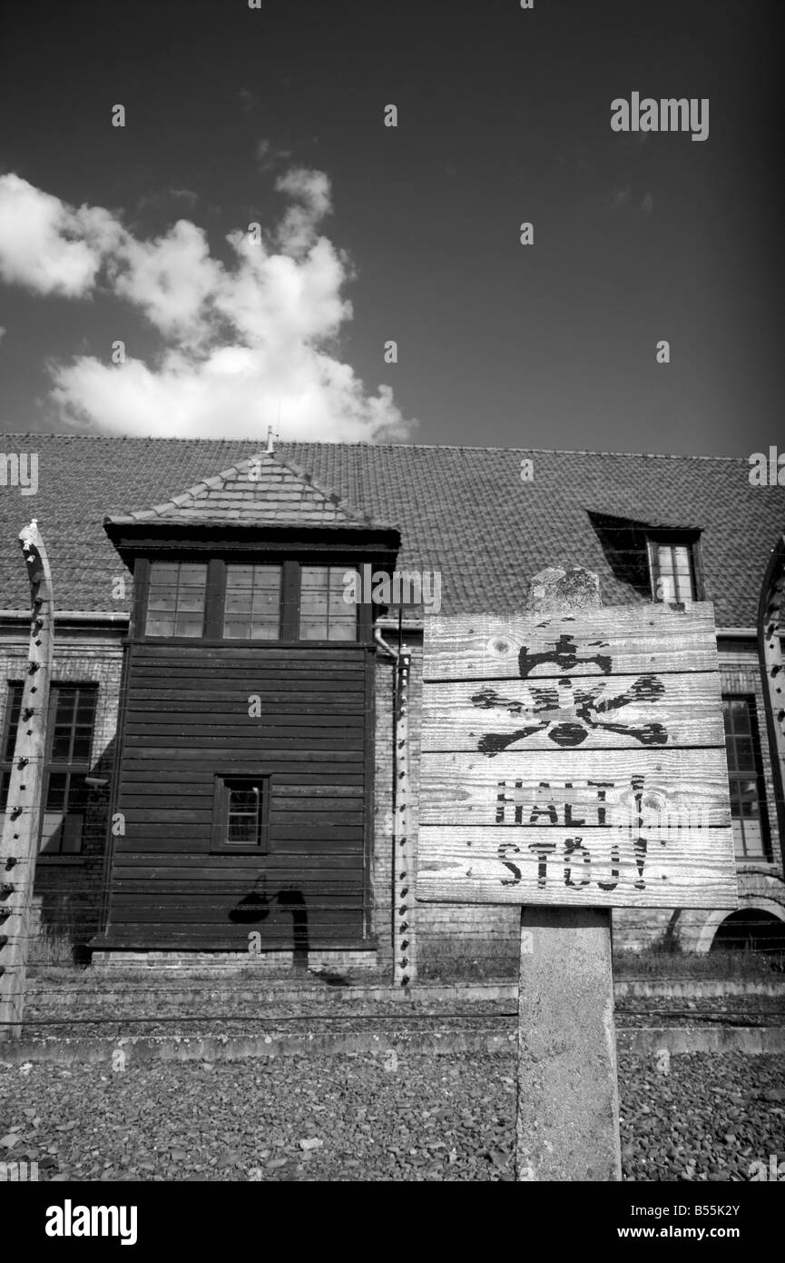 Warning stop sign with skull&bones symbol in front of barbed wire ...