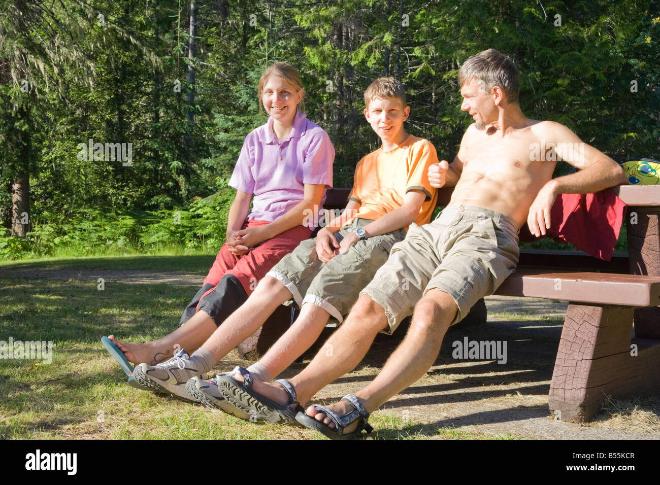 Happy family on bench Wells Gray Provincial Park British Columbia ...