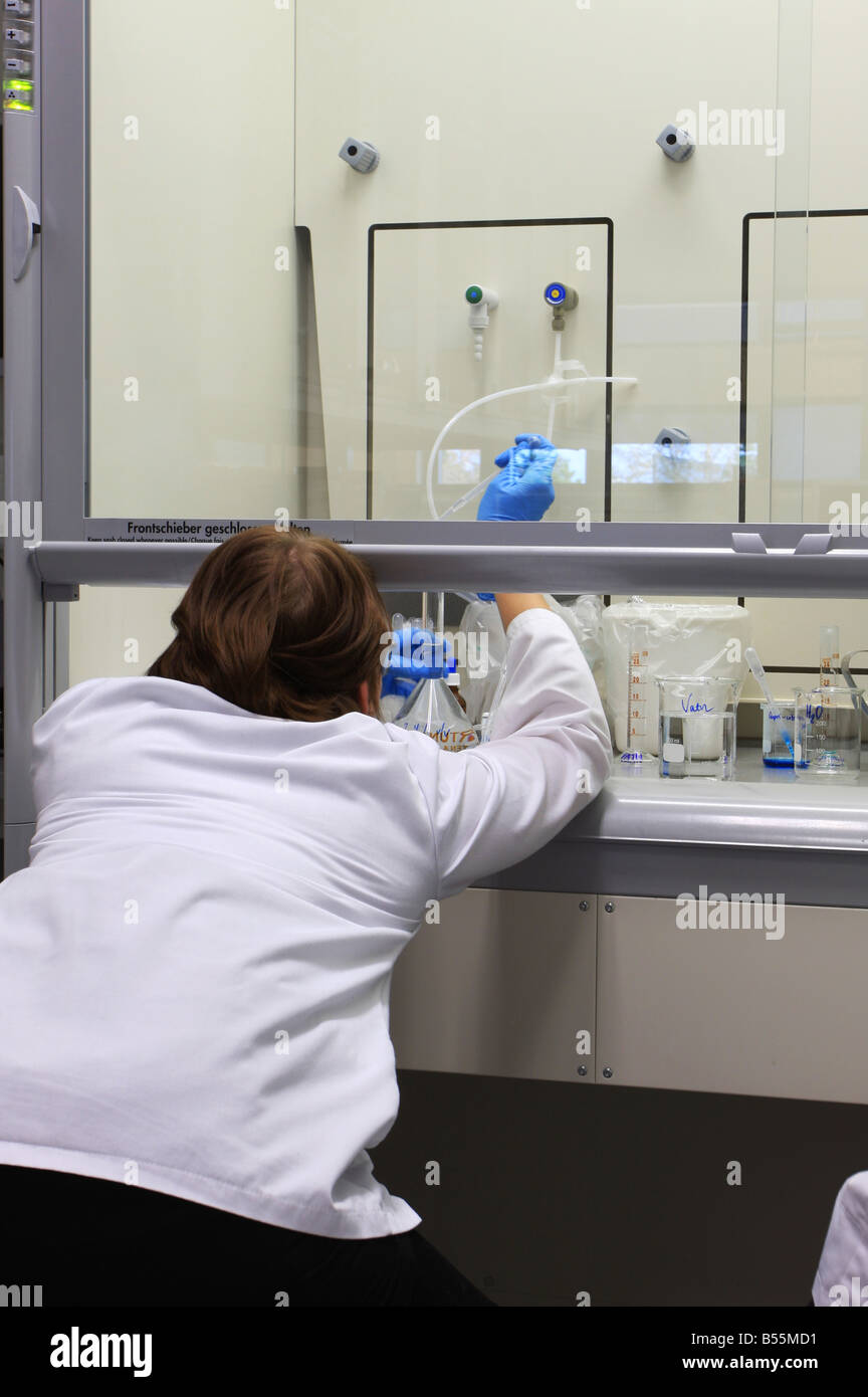 scientist working with test tubes and substances in a real laboratory ...
