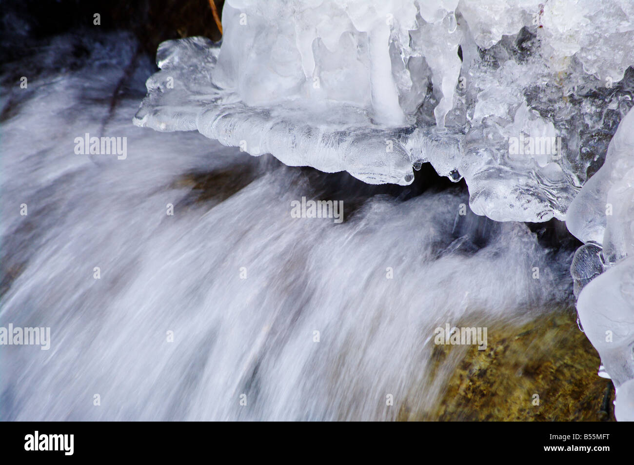 a icy waterfall in a small brook Stock Photo - Alamy