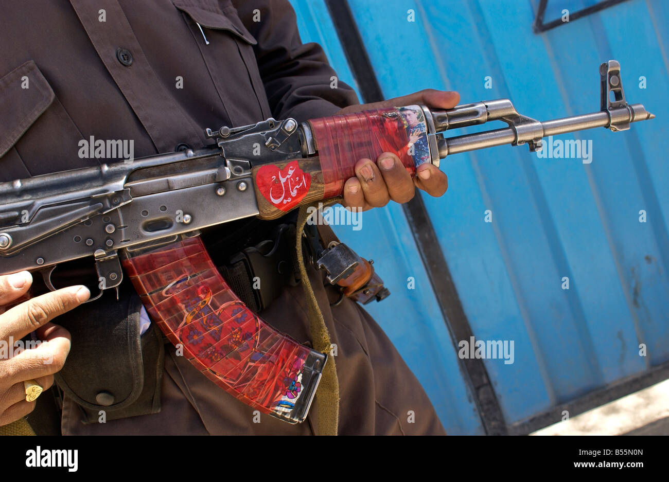 A guard holds his weapon outside the governor's office in Gardez ...