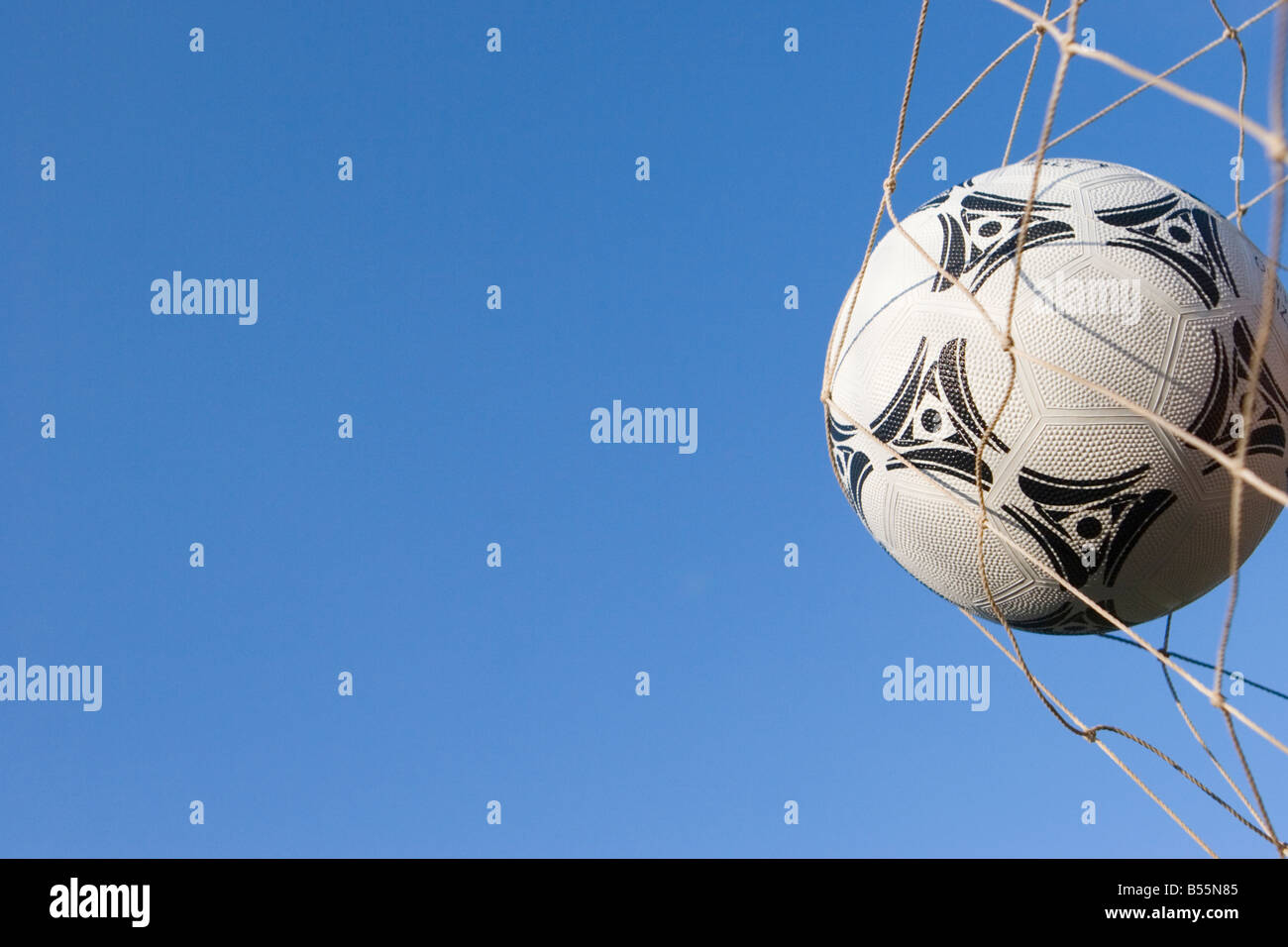 Football in the back of the net hi-res stock photography and images - Alamy