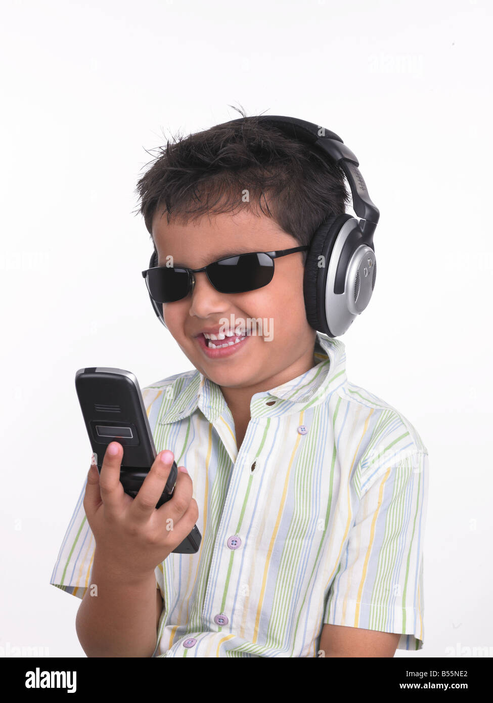 Asian boy of indian origin talking in his cell phone Stock Photo - Alamy