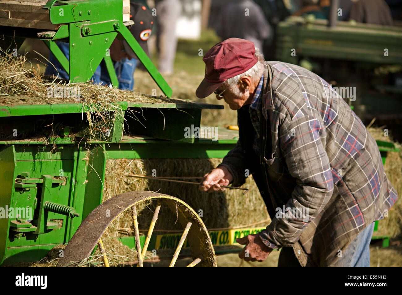 Hay bailing demonstration with a belt driven hay press during steam ...