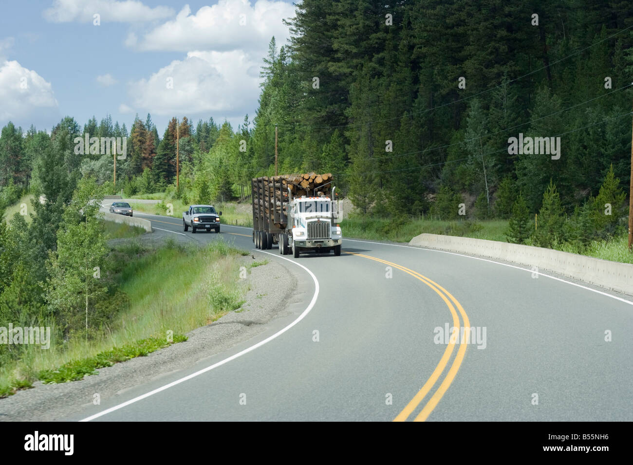 Semi truck and two cars on the road hi-res stock photography and images ...