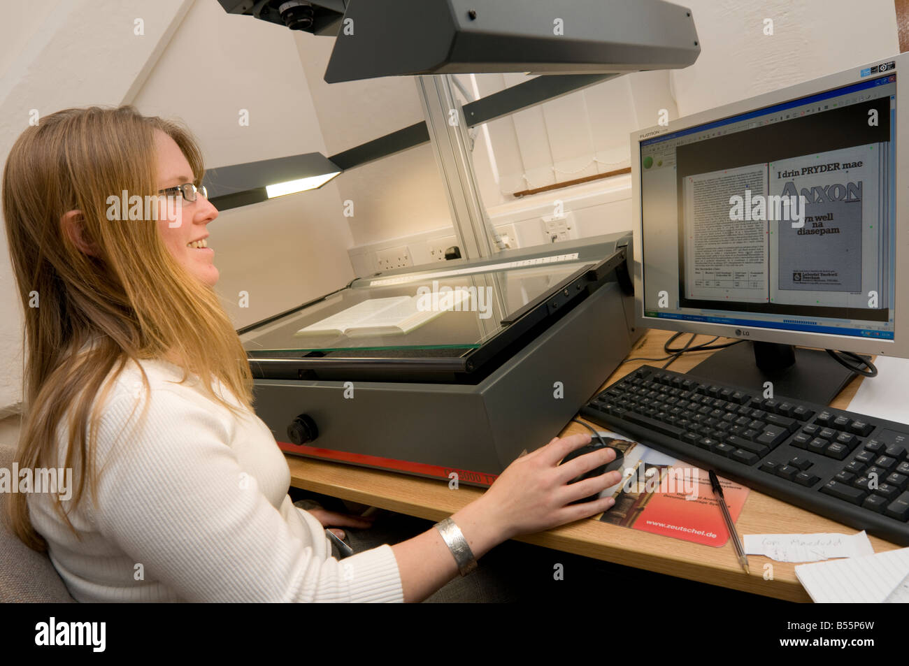 woman archivist, National Library of Wales Aberystwyth scanning ...