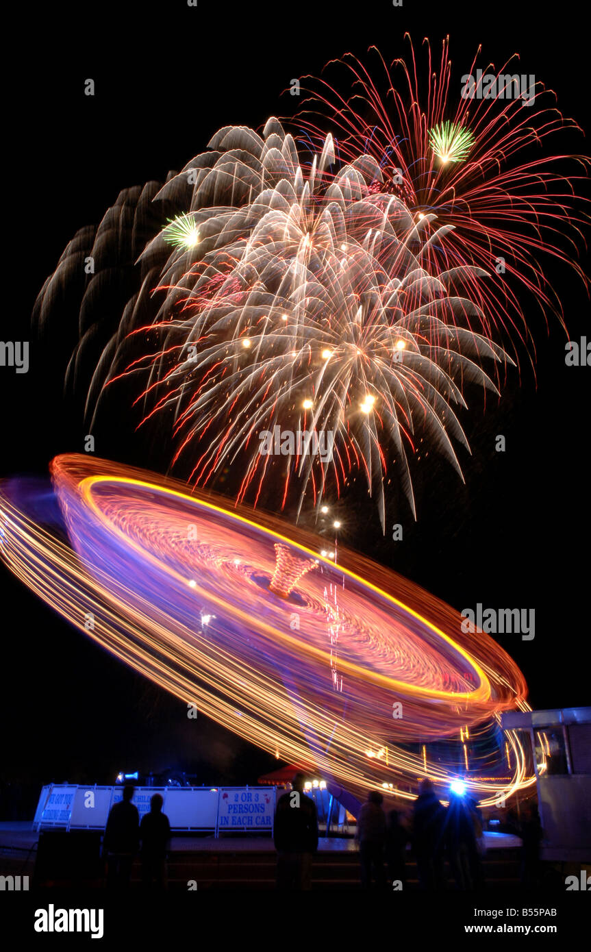 Fireworks and fairground ride Stock Photo - Alamy