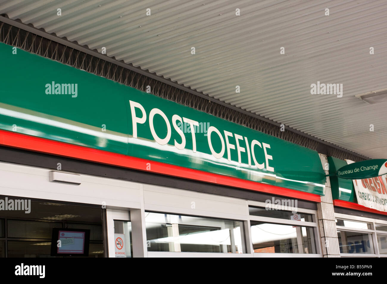 Post Office sign above entrance Stock Photo - Alamy