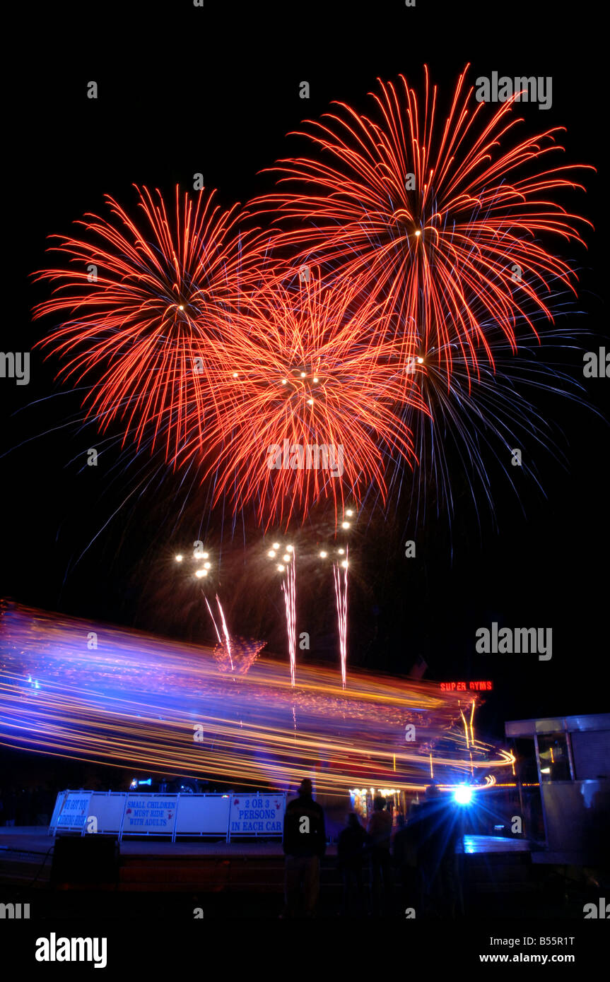 Fireworks and fairground ride Stock Photo - Alamy