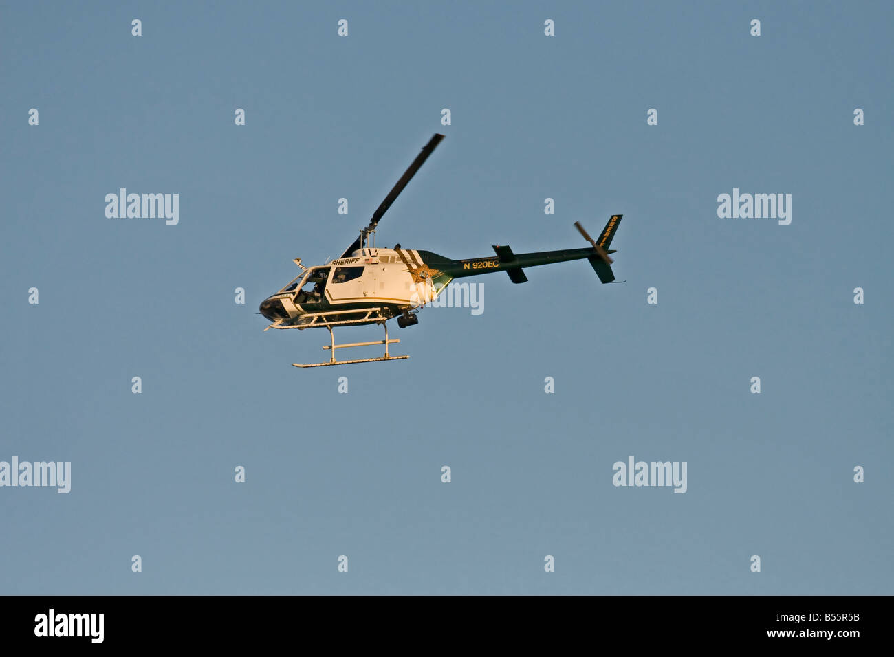 Helicopter flying around at the beach Stock Photo - Alamy