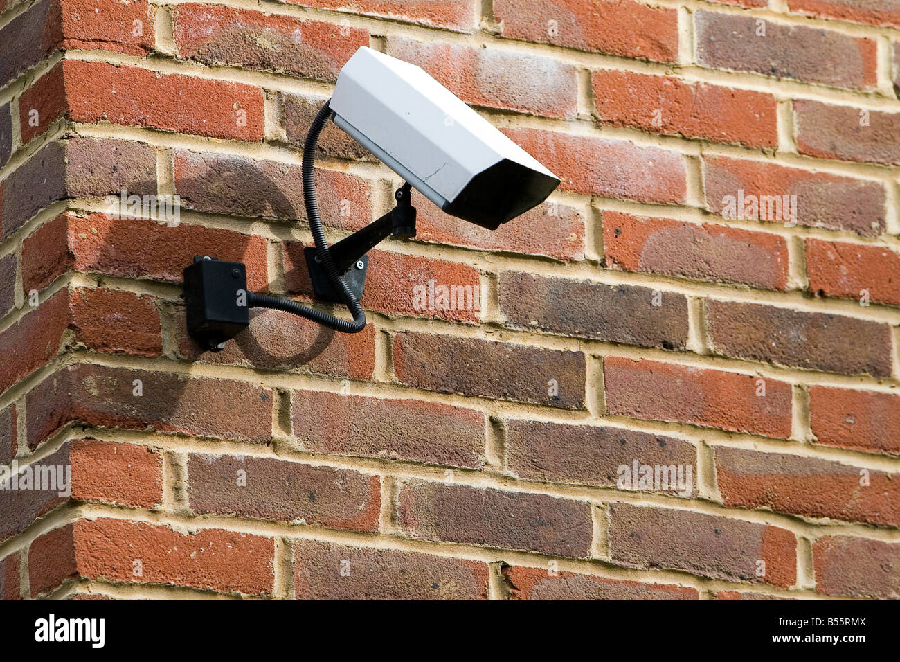 CCTV Camera Attached To Wall Stock Photo - Alamy