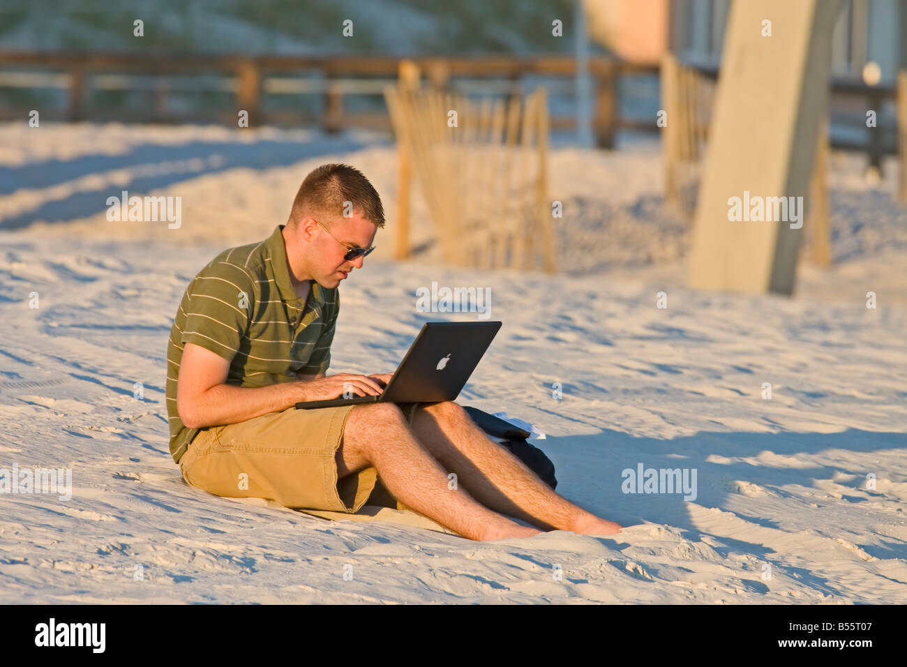 College student on the beach doing studies Stock Photo - Alamy