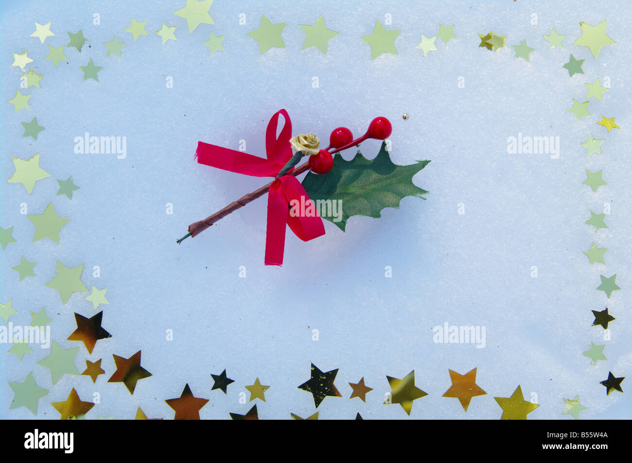 golden snow stars on a real snowy icy surface Stock Photo - Alamy