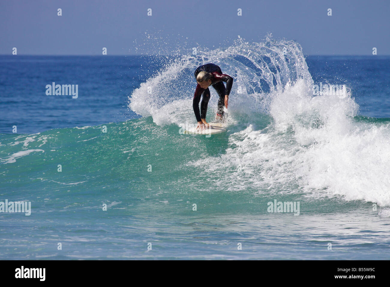 Surfer riding a wave Stock Photo - Alamy