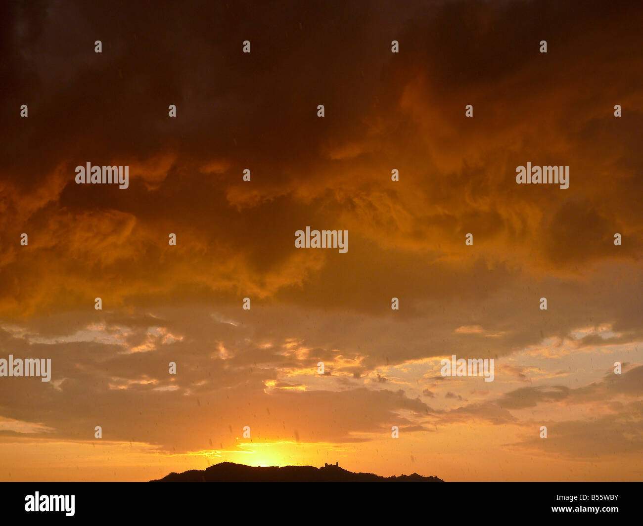 Rain clouds over sunset hi-res stock photography and images - Alamy