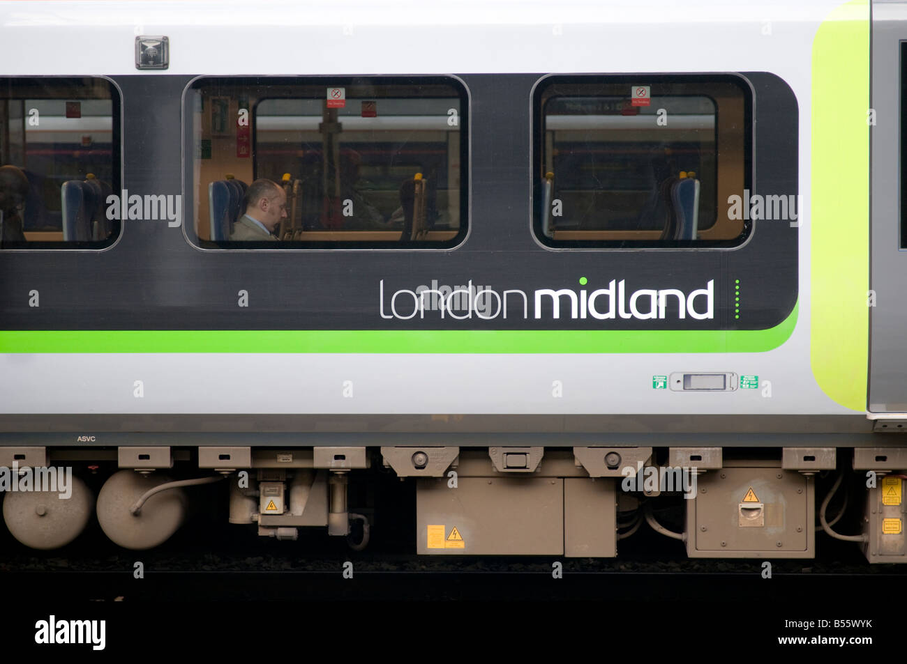 passenger on board a London Midland diesel local commuter train at ...