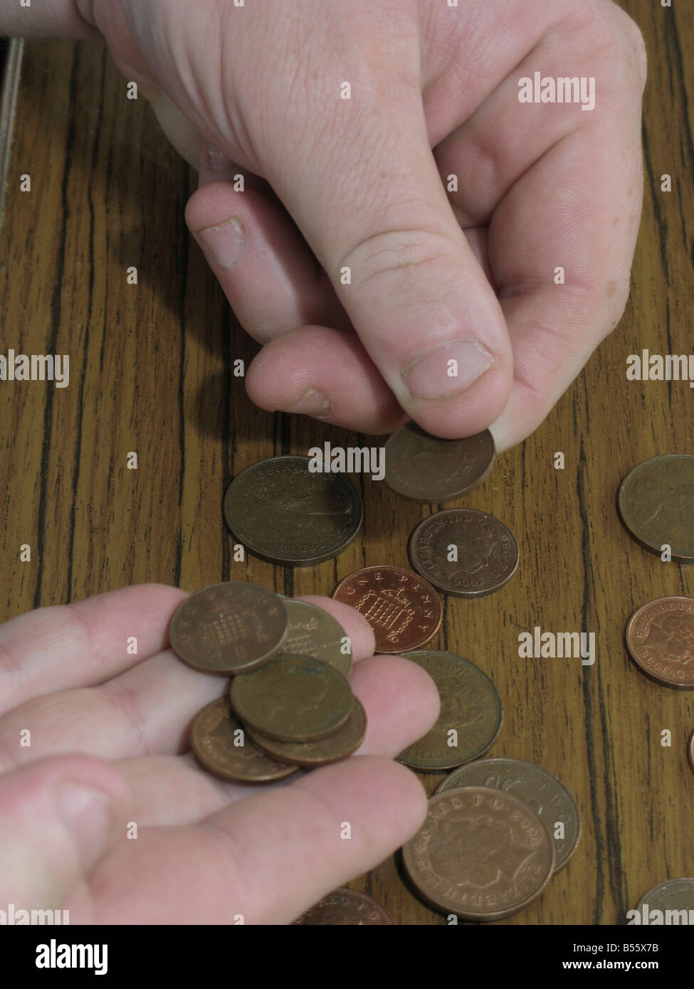 man counting the pennies Stock Photo - Alamy