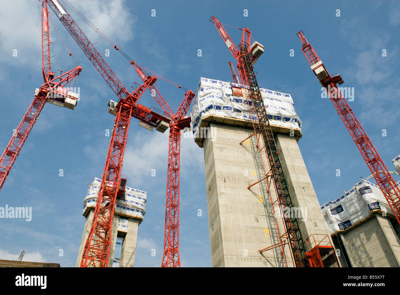 looking up at construction cranes Stock Photo - Alamy