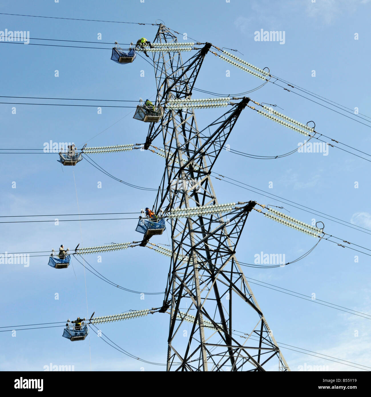 Engineers working on overhead power lines Stock Photo - Alamy