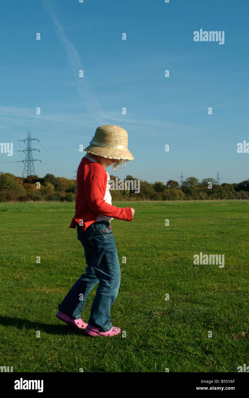 Little girl playing in the countryside Stock Photo - Alamy