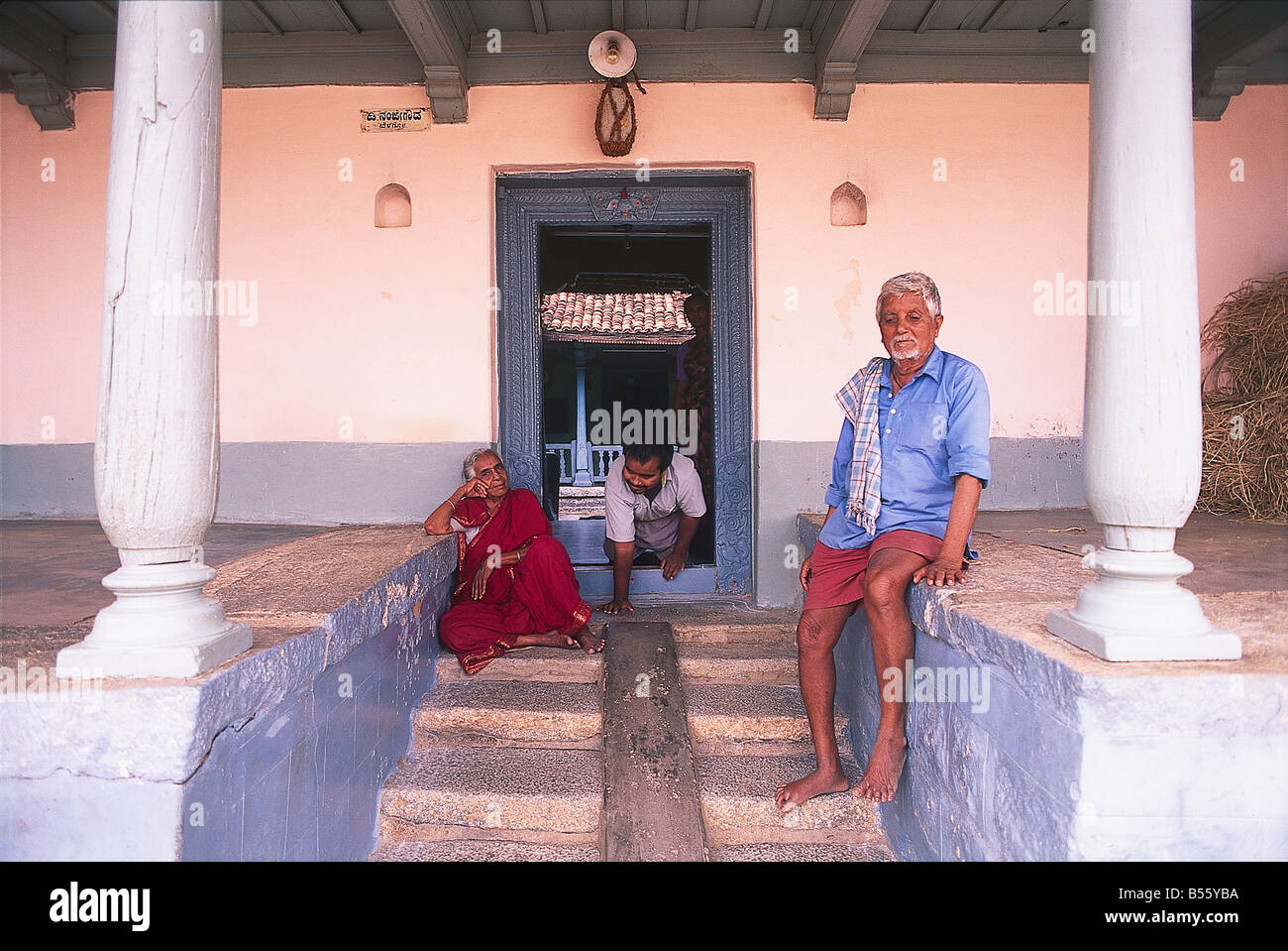indian family outside traditional family home Stock Photo - Alamy