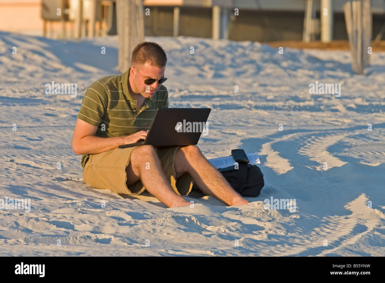 Doing work on computer on the beach Stock Photo - Alamy