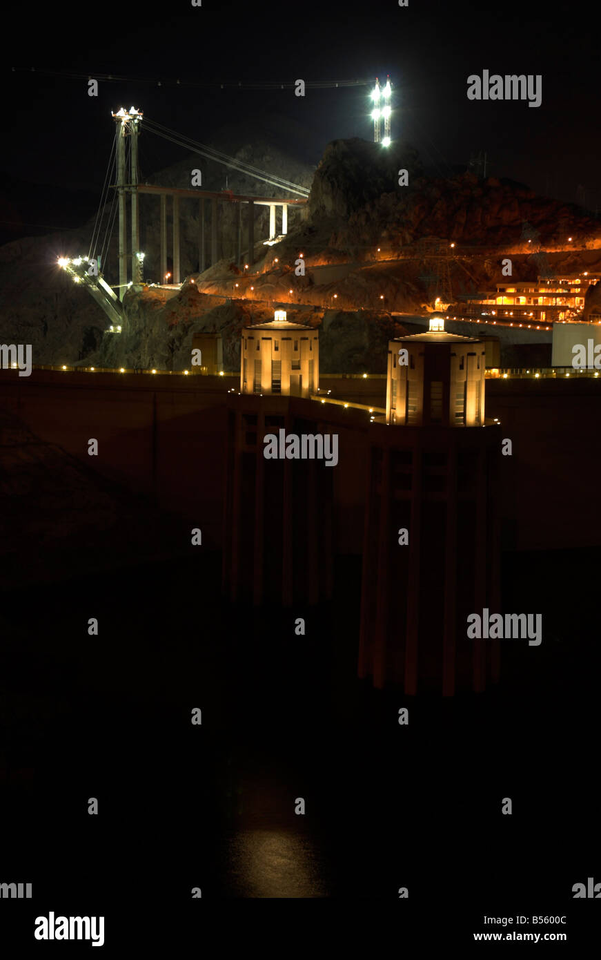 A(vertical)night shot of Hoover Dam at the Arizona/Nevada border. The ...