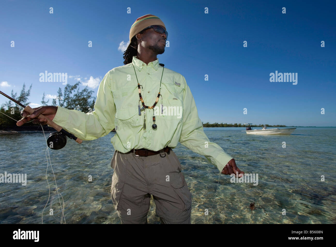 Bonefishing guide Shawn Leadon fishing for bonefish in shallow waters ...