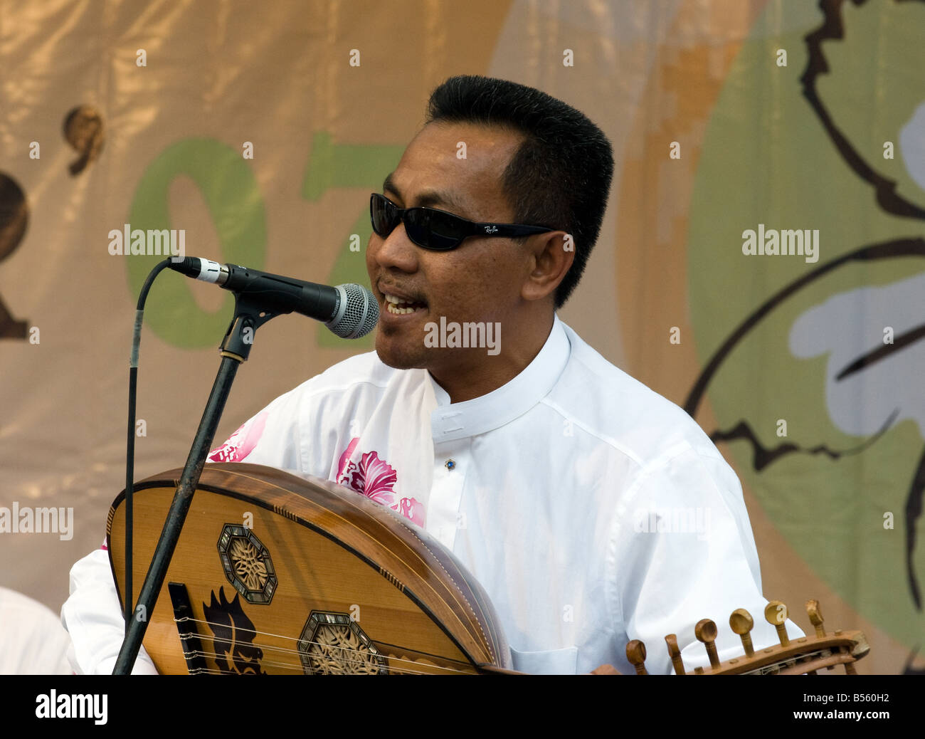 Playing the gambus hi-res stock photography and images - Alamy