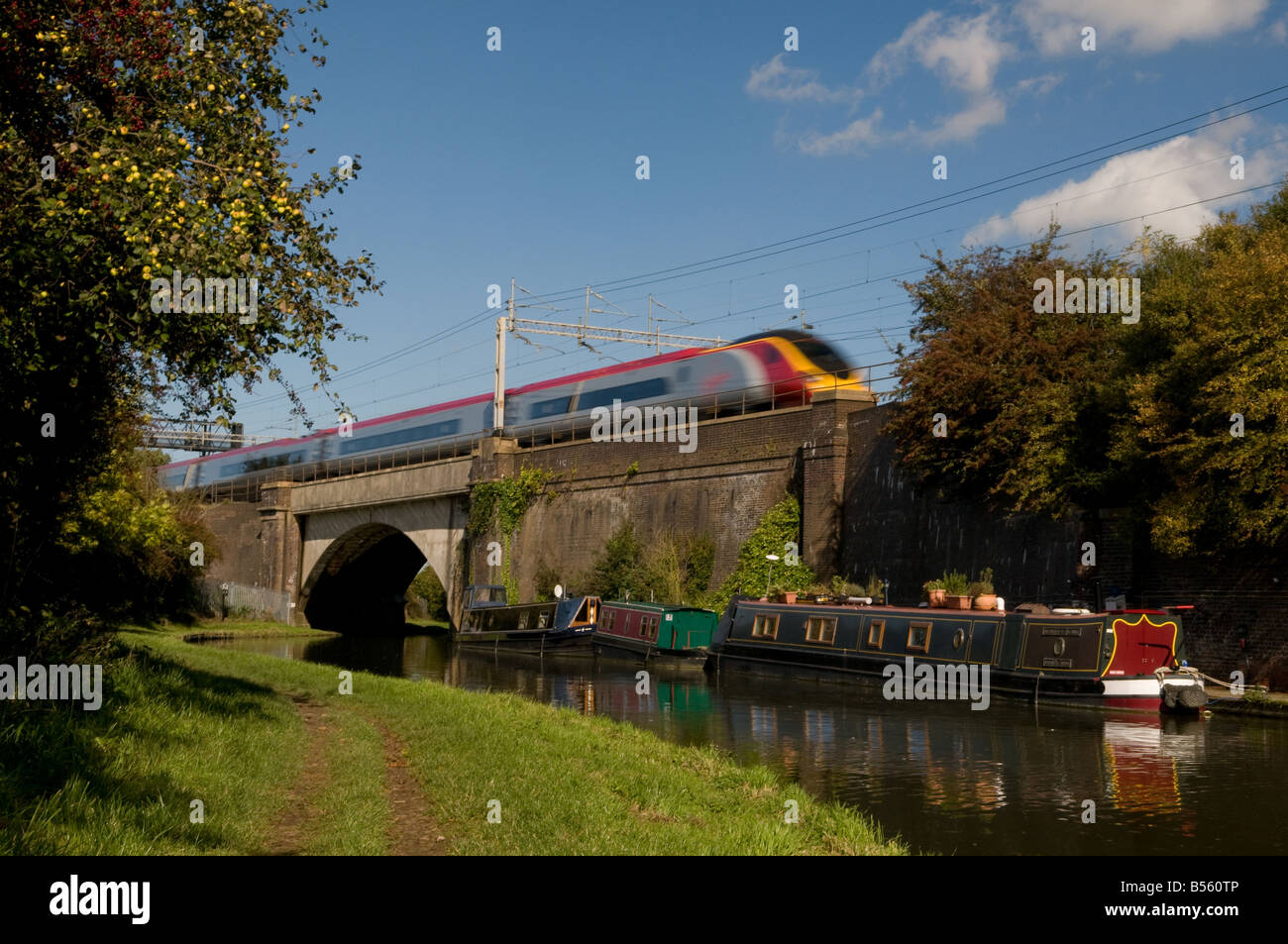 Intercity train flies over a canal bridge Stock Photo - Alamy