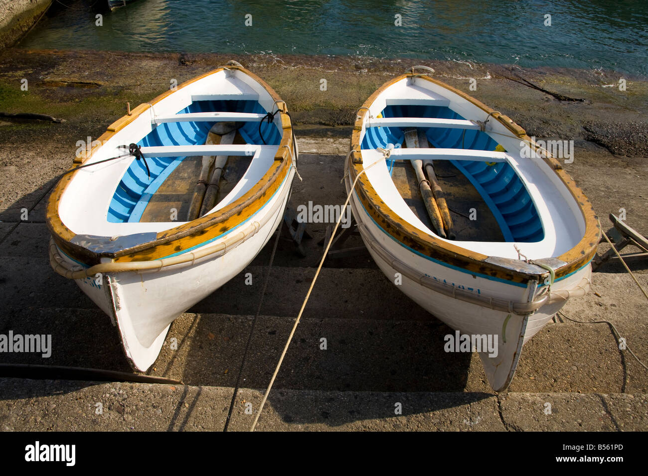 Two rowing boats on steps beside the harbour, Marina Grande, Capri ...