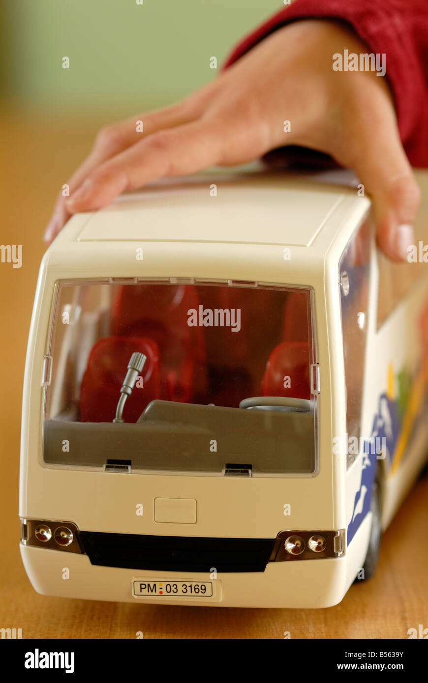 toy and hand Stock Photo - Alamy