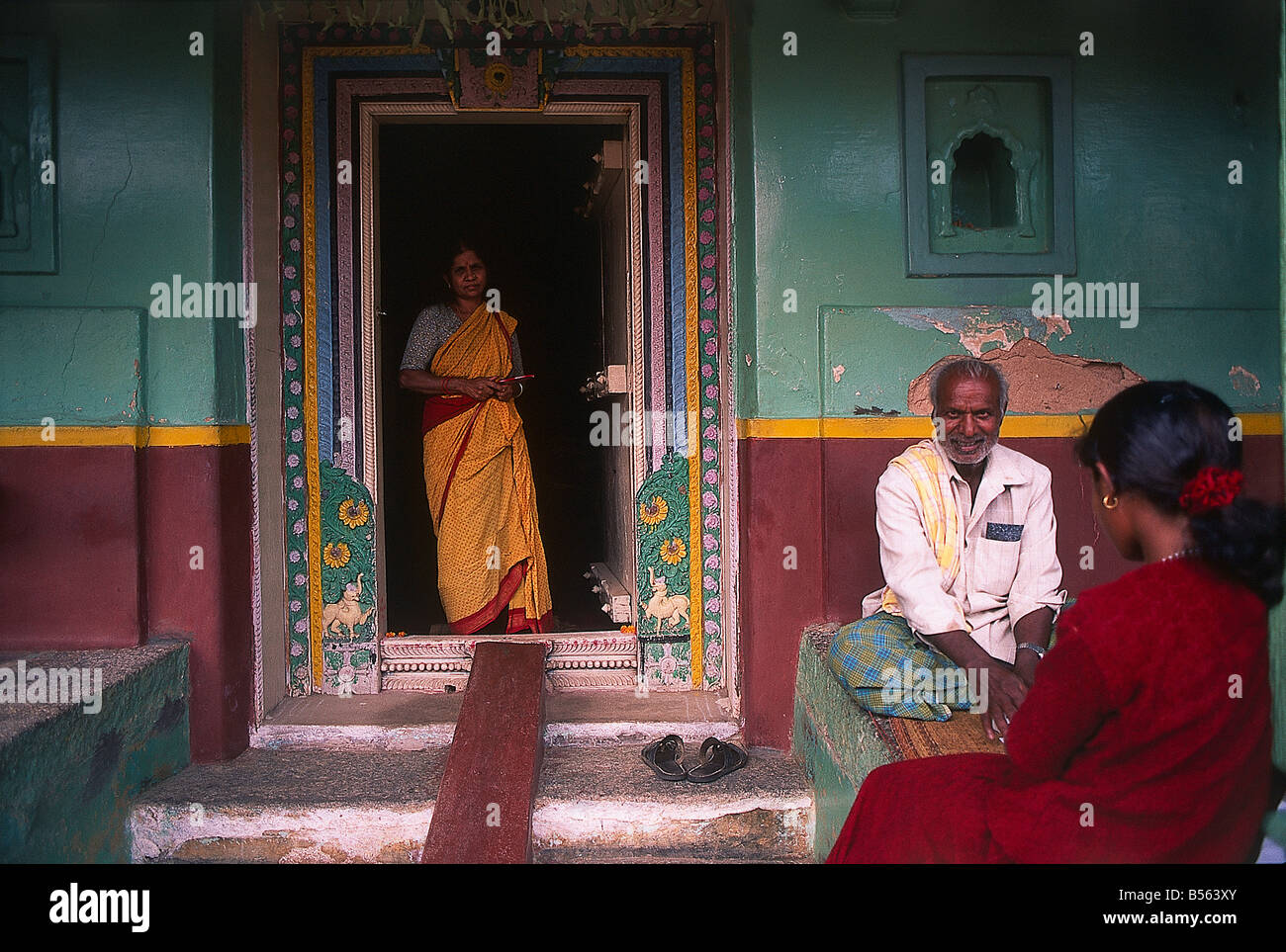 Indian family outside traditional indian home Stock Photo - Alamy