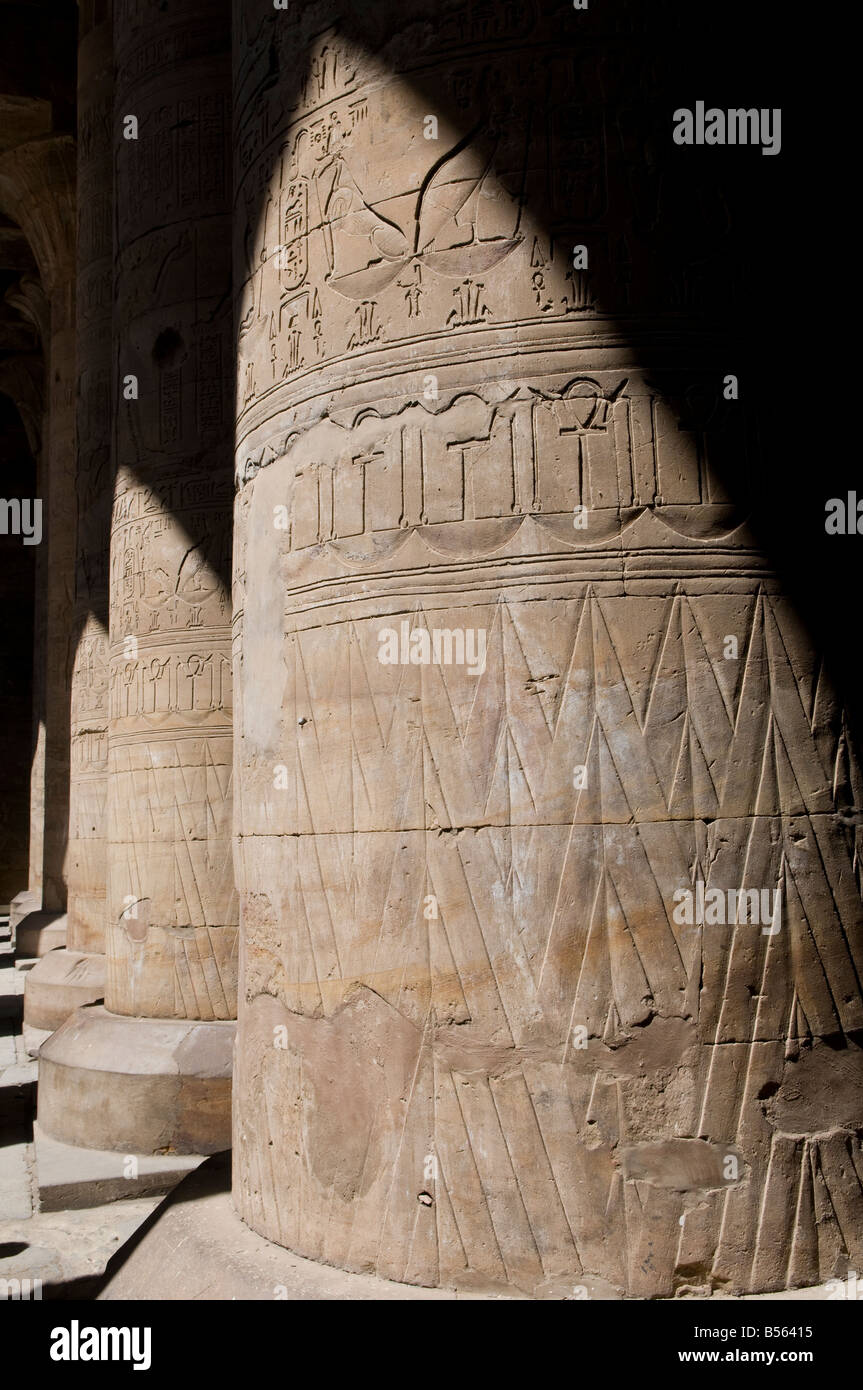 Carved columns with hieroglyphs writing at the hypostyle hall of the ...