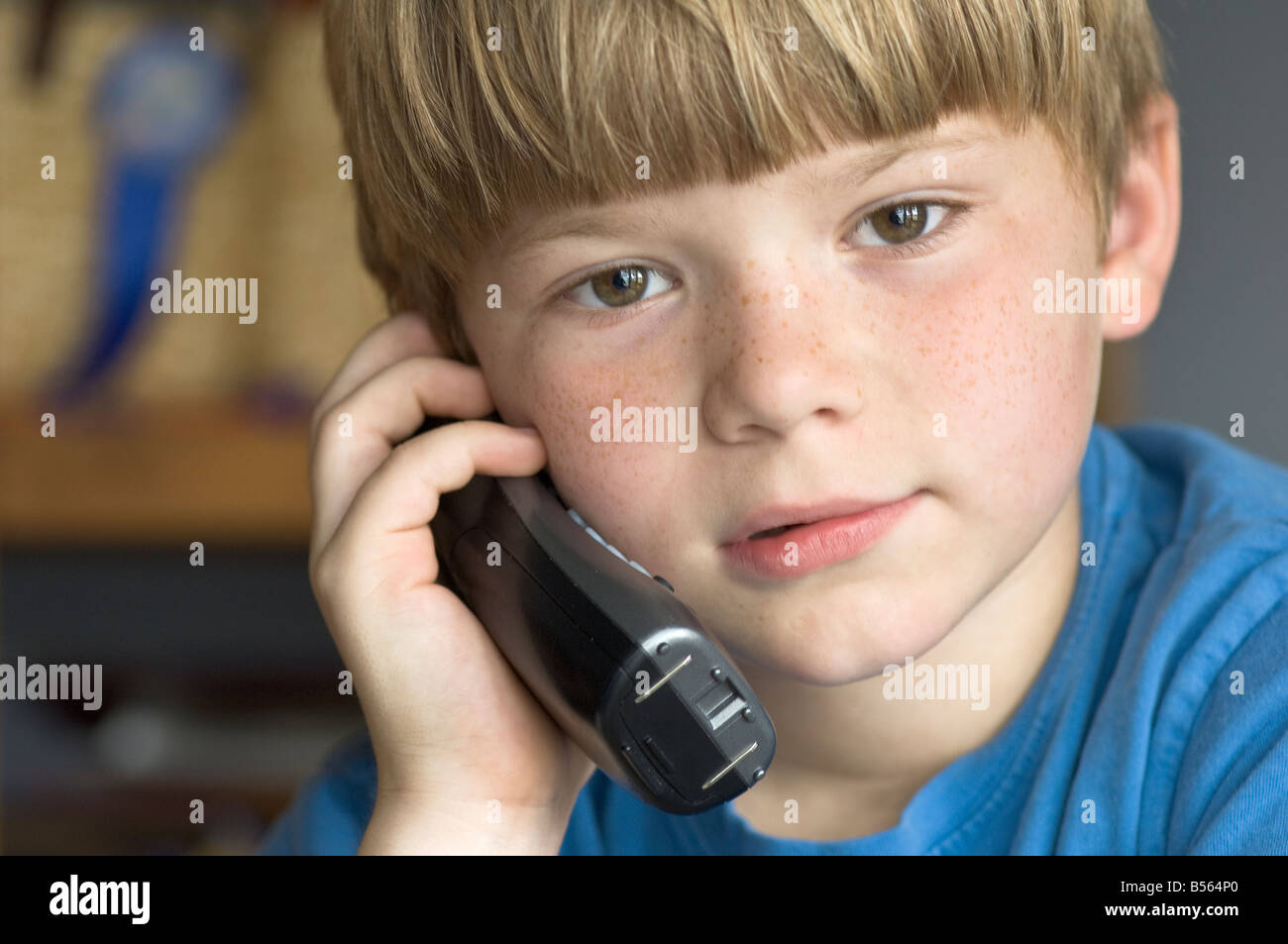 Young boy talking on cordless Phone Stock Photo - Alamy
