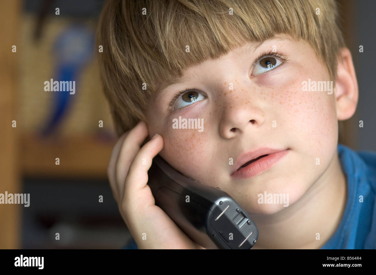 Young boy talking on cordless Phone Stock Photo - Alamy