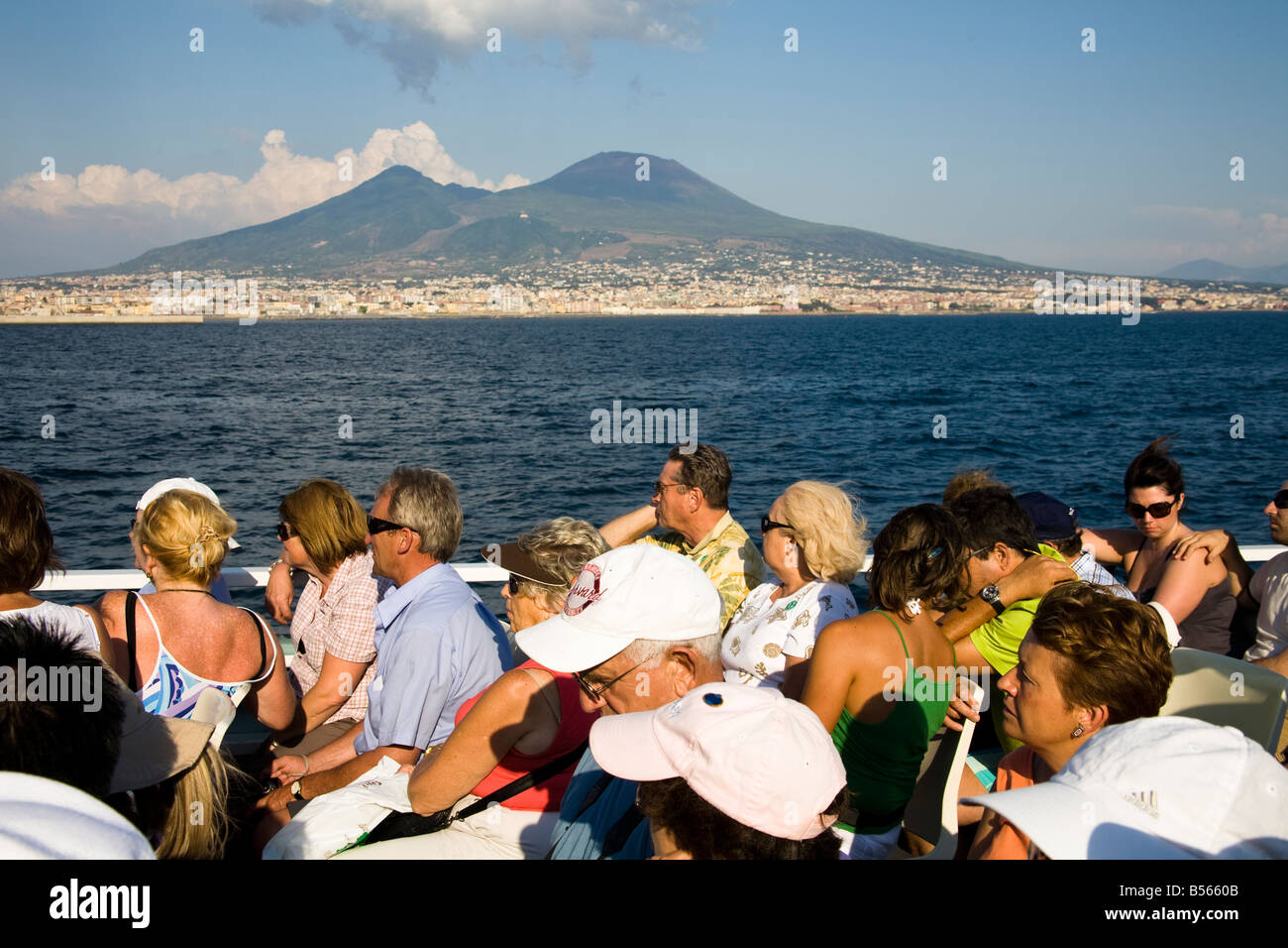 Boat passengers and Mount Vesuvius, Bay of Naples, Italy Stock Photo ...
