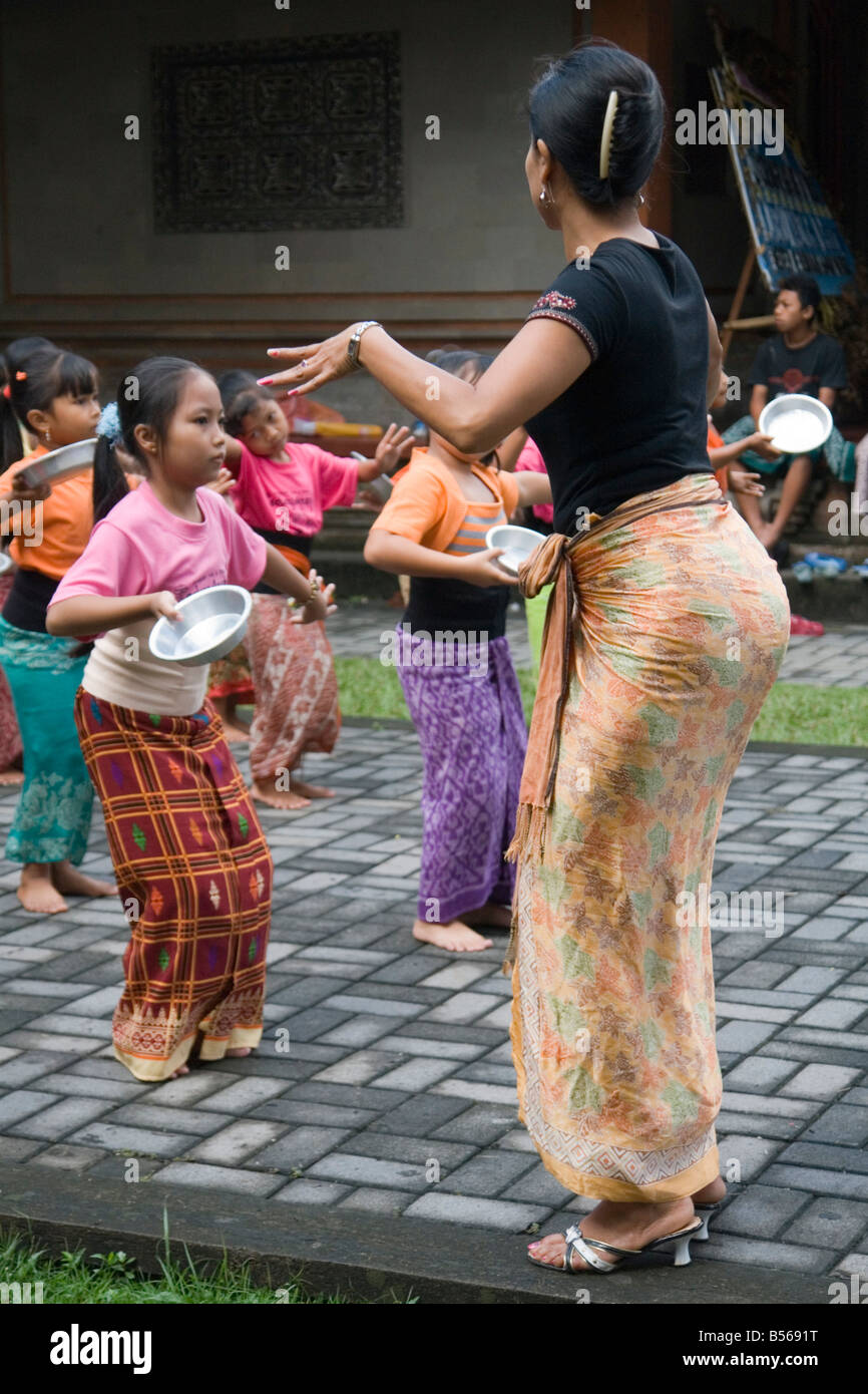 A dancing teacher with her pupils in Ubud (Bali - Indonesia ...