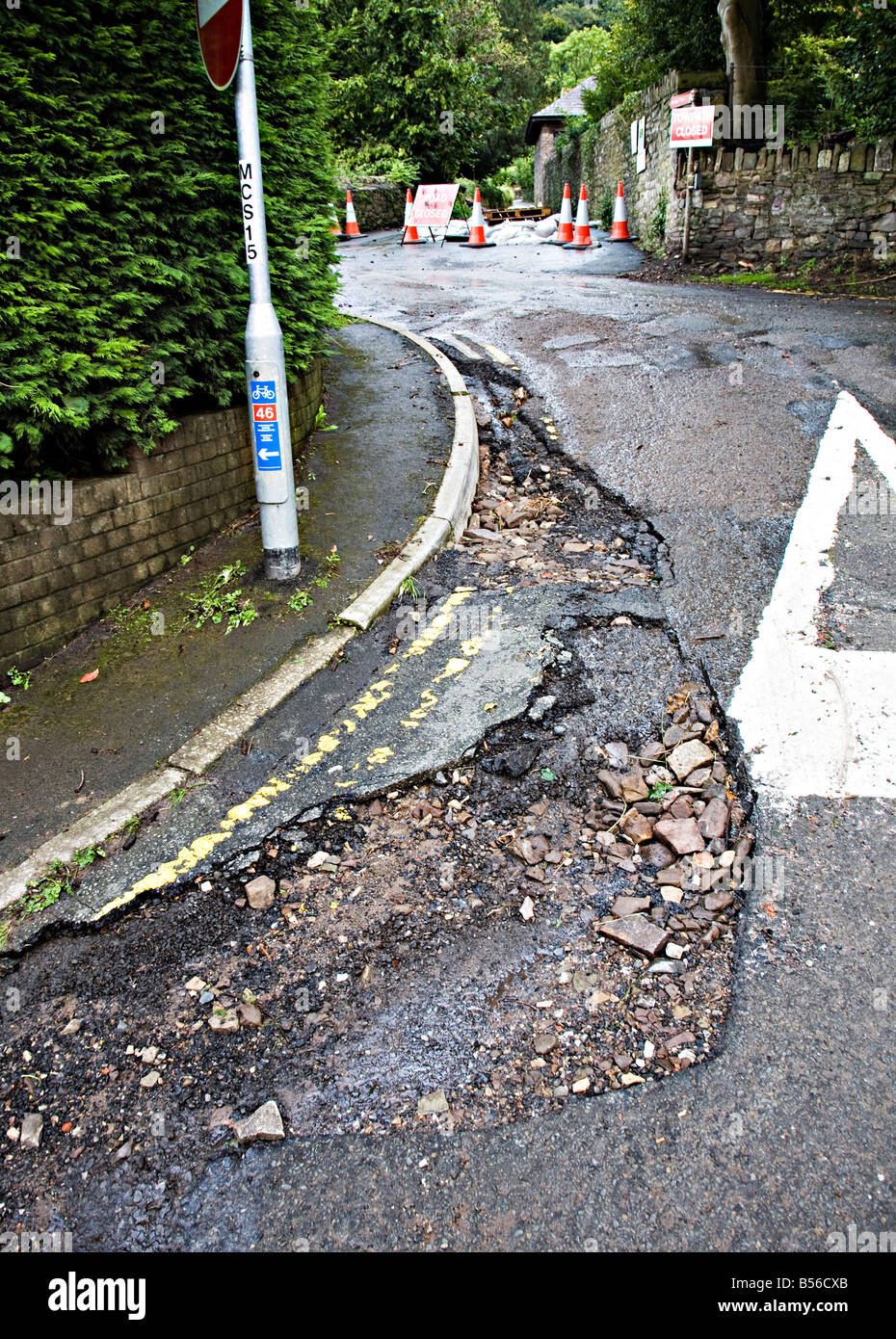 Damage to road surface due to flooding Llanfoist Wales UK Stock Photo ...