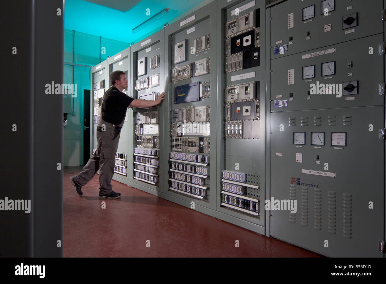 Engineer in electricity substation providing electrical power to the ...