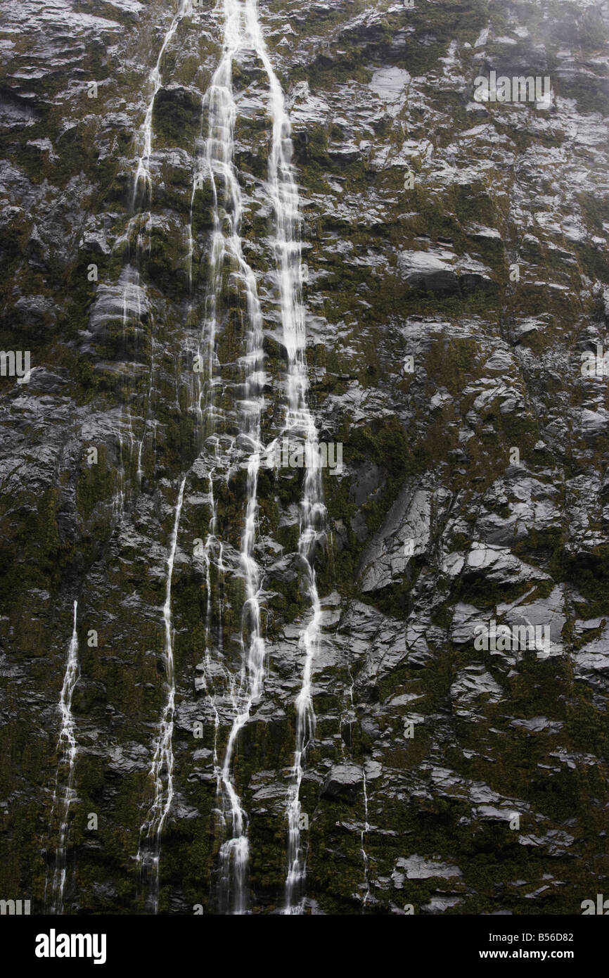 Waterfall Water running down wet cliff face Milford Sound Fiordland ...