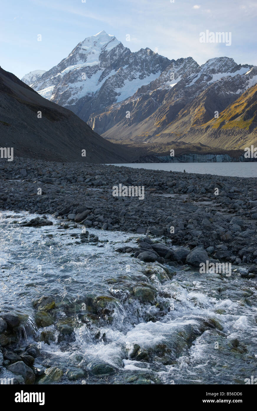 Stream forming waterfall infront of snow capped Mt Cook Aoraki Mt Cook ...