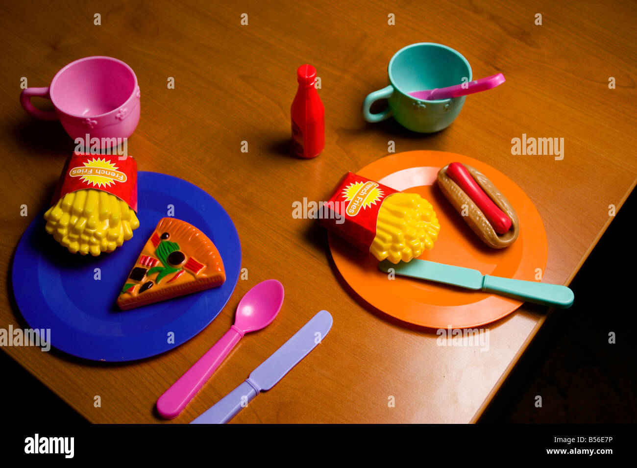 A table setting of plastic toy food Stock Photo - Alamy